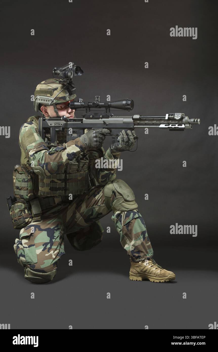 NATO soldier in full gear. Military man over black background Stock ...