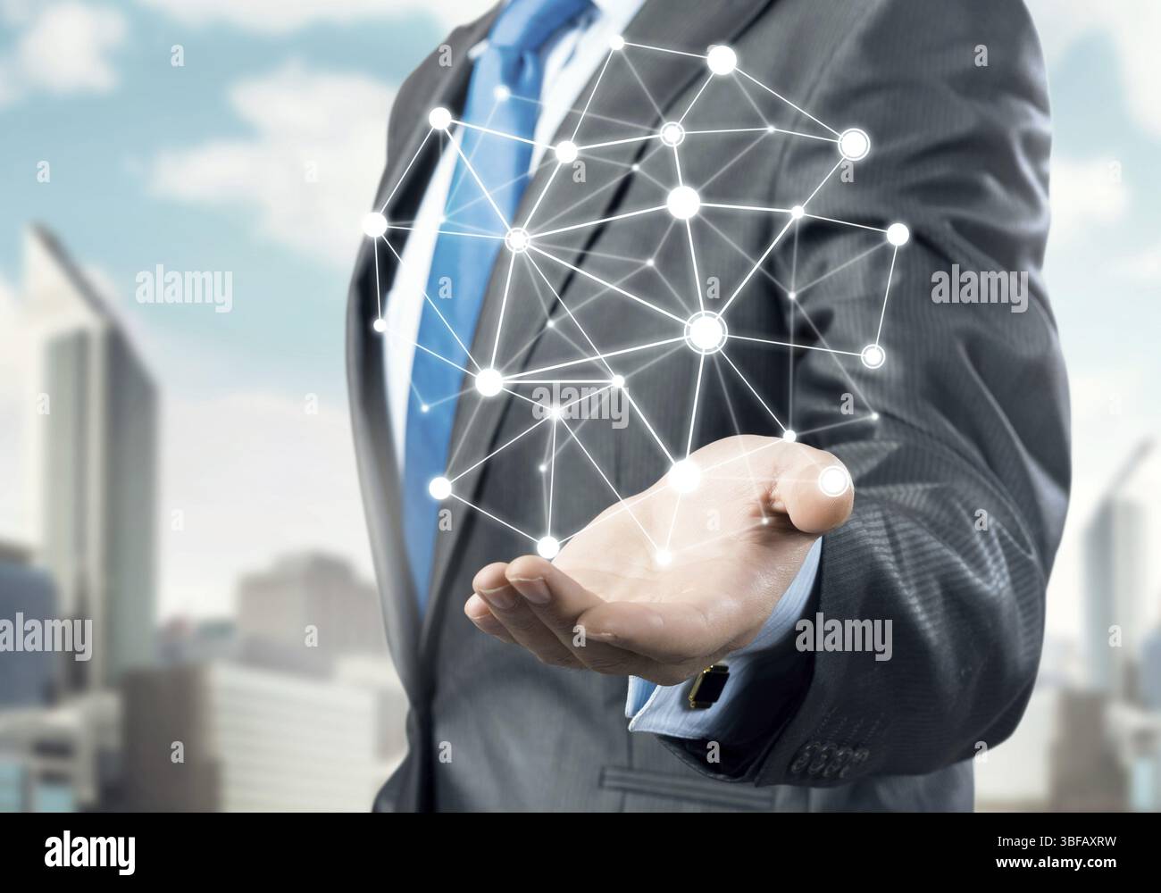 Businessman hand showing digital connection lines on city landscape ...