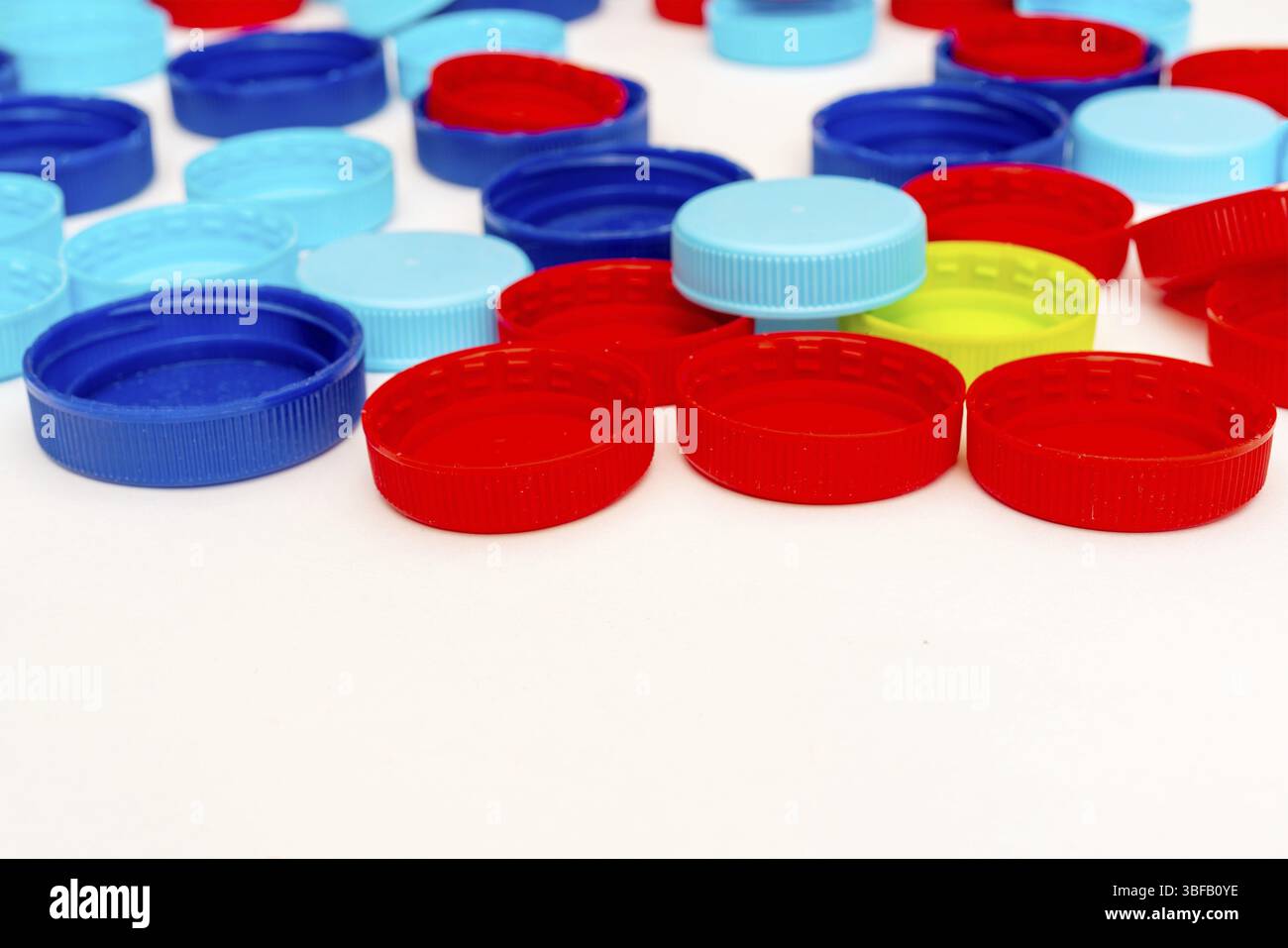 Plastic bottle caps. Separate garbage collection. Waste disposal Stock ...