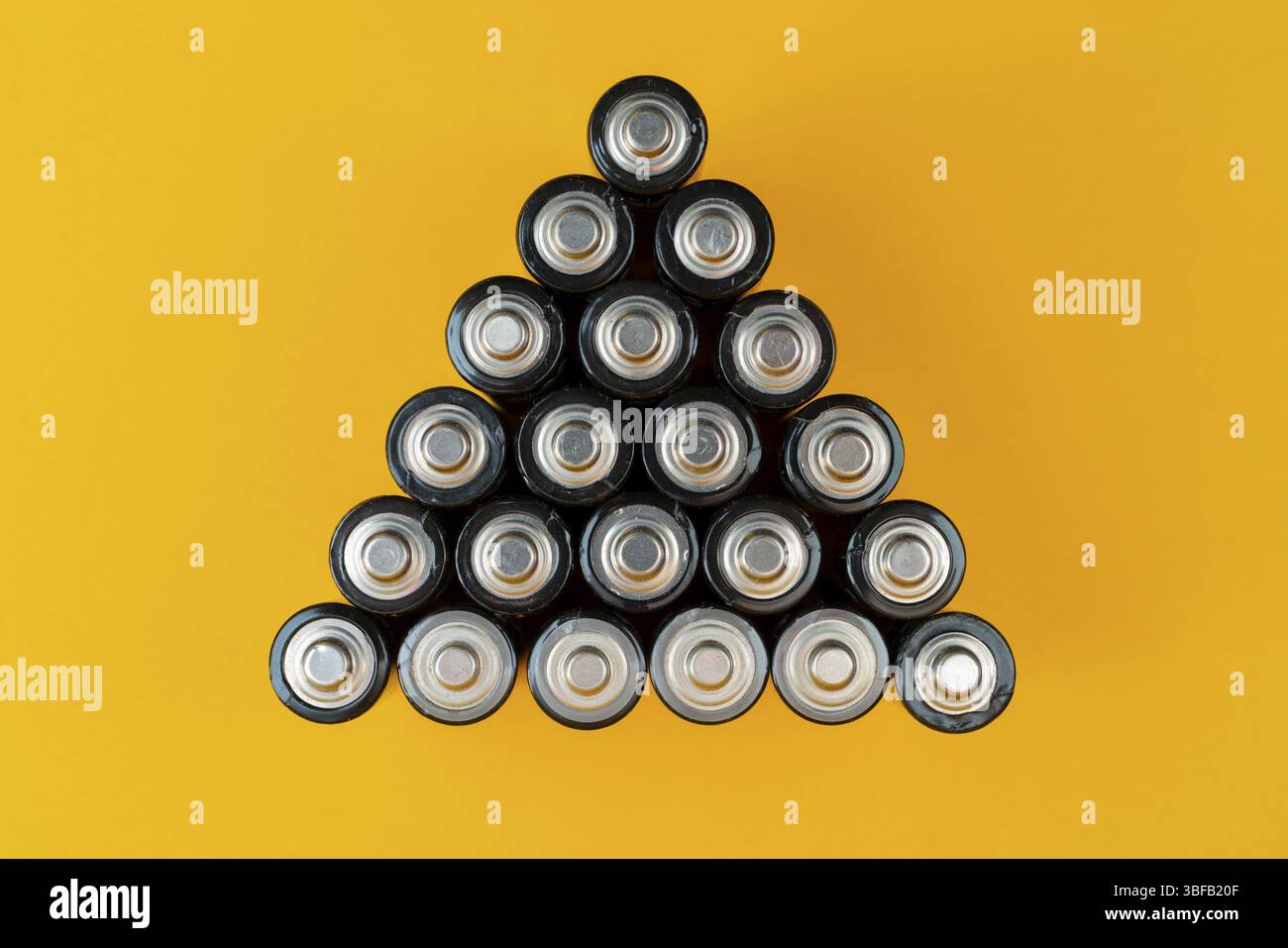 Used batteries are arranged in a triangle shape. Recycling and disposal ...