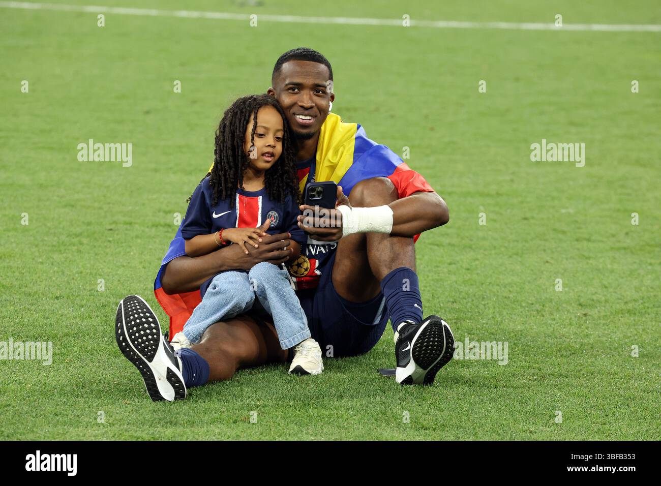 Munich, Germany May 31, 2025: William Pacho of PSG holds his daughter ...