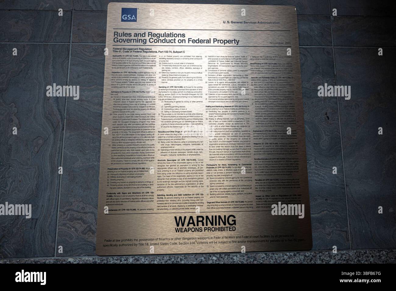 A plaque with the rules and regulations of conduct on Federal property ...