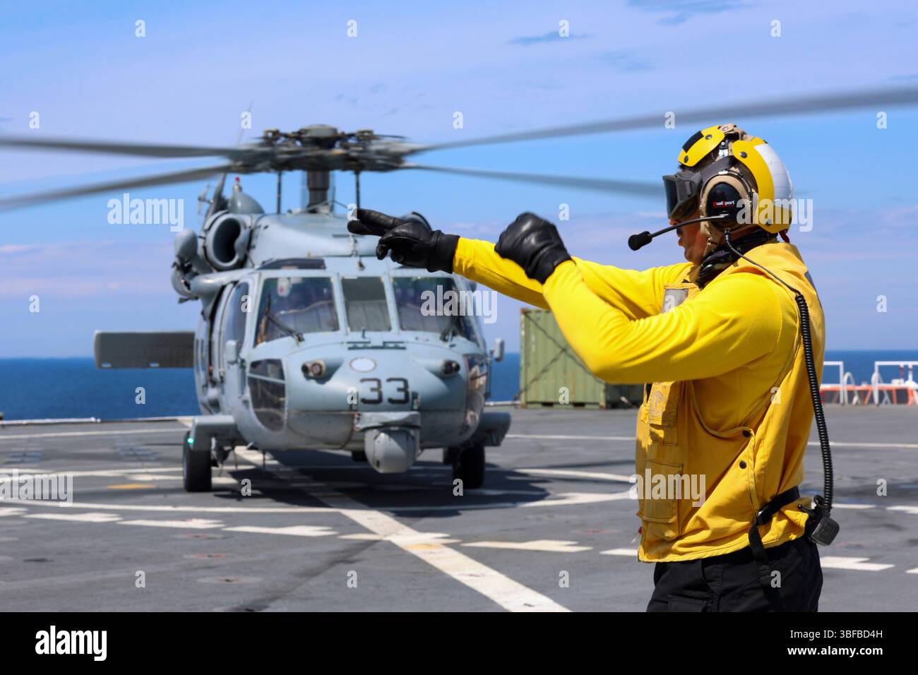 Aviation Boatswains Mate 3rd Class Colton Clark directs flight ...