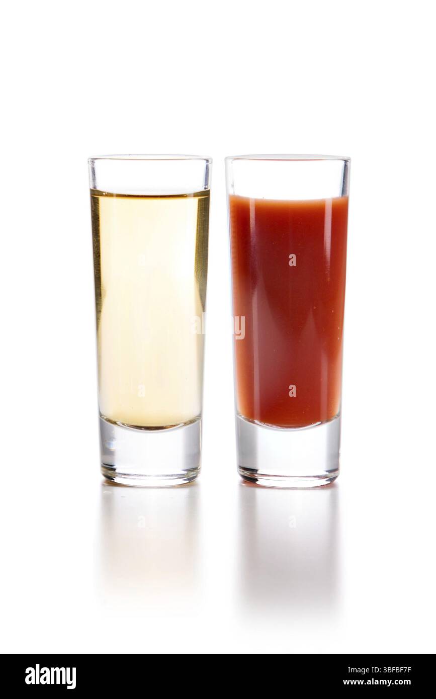 Tequila Gold with Sangrita Chaser. Closeup shoot. Isolated over white ...