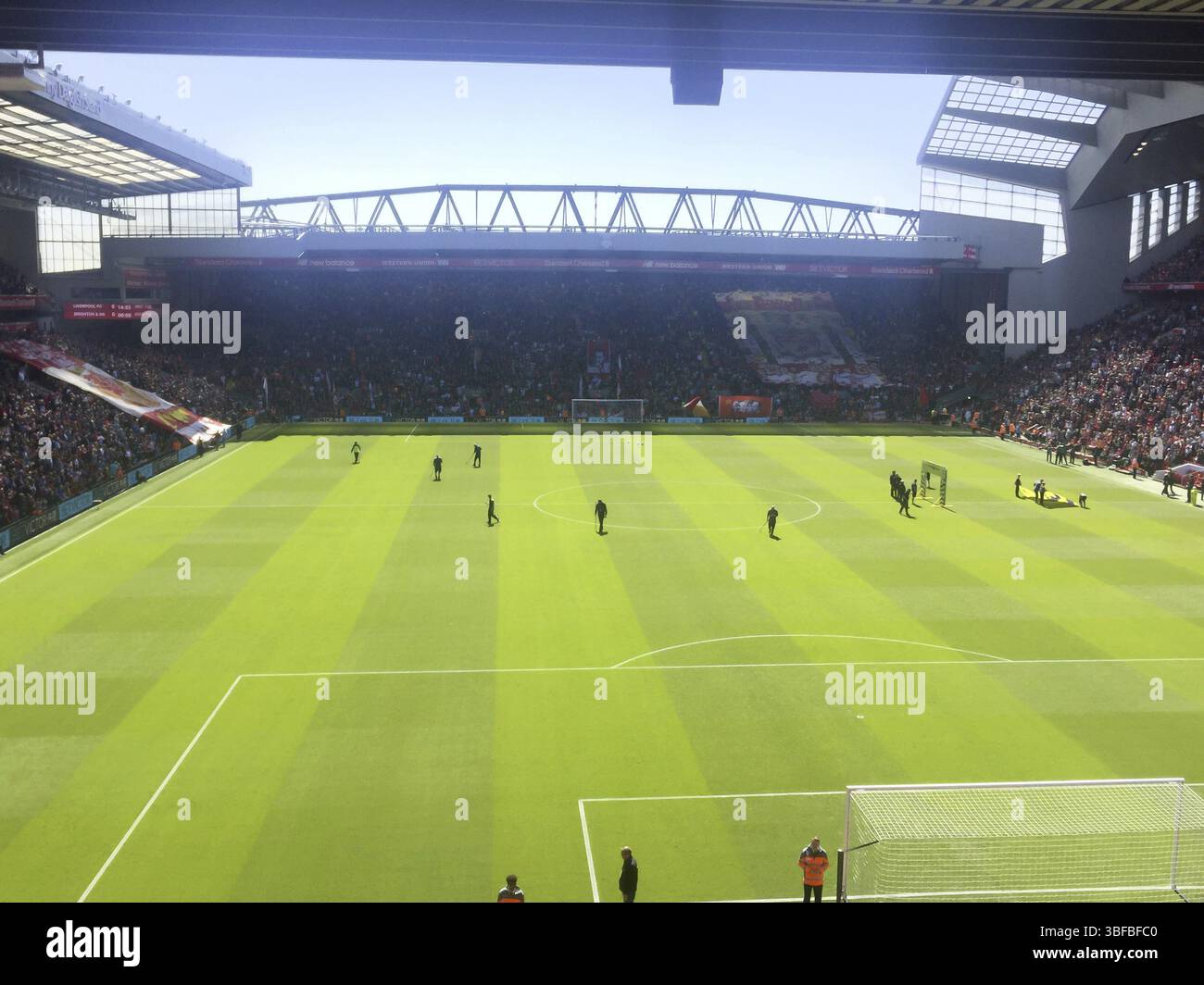A football stadium with players Stock Photo - Alamy