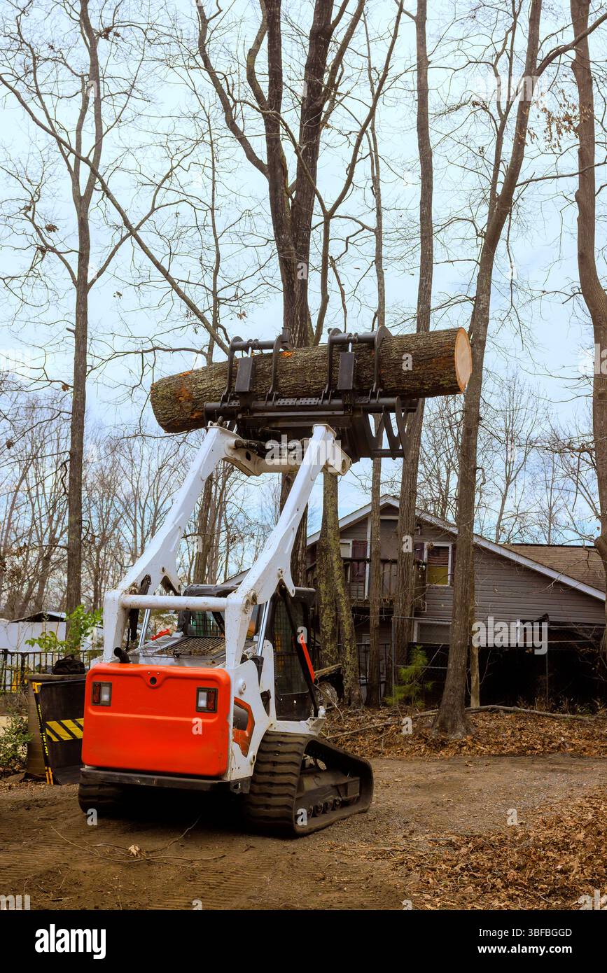Equipment is used to lift transport large tree logs in wooded ...