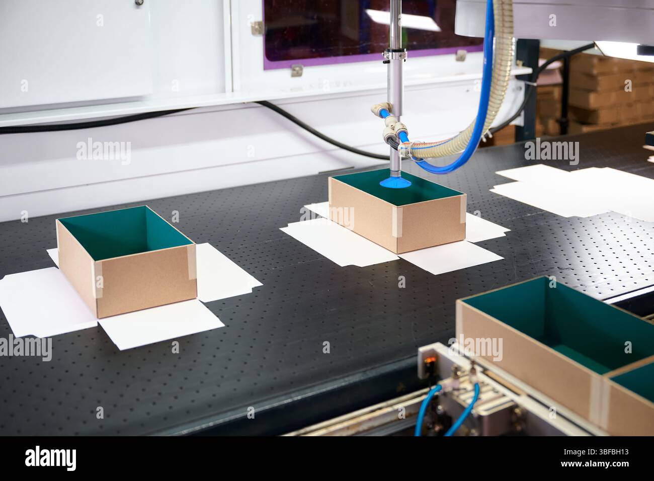 Innovative robot technology streamlines packaging process in decorative box factory Stock Photo ...