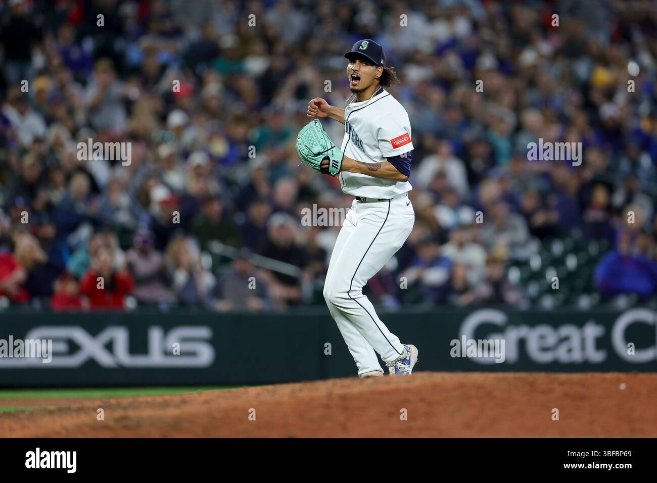 Seattle Mariners relief pitcher Carlos Vargas reacts after making a ...