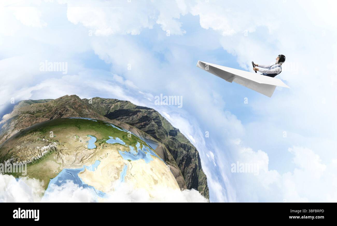 Pilot in leather helmet and goggles driving paper plane on background ...