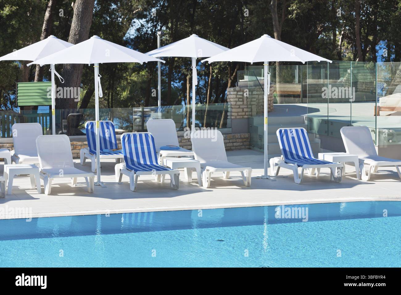 Hotel Poolside Chairs with Sea view. Summer shot Stock Photo - Alamy