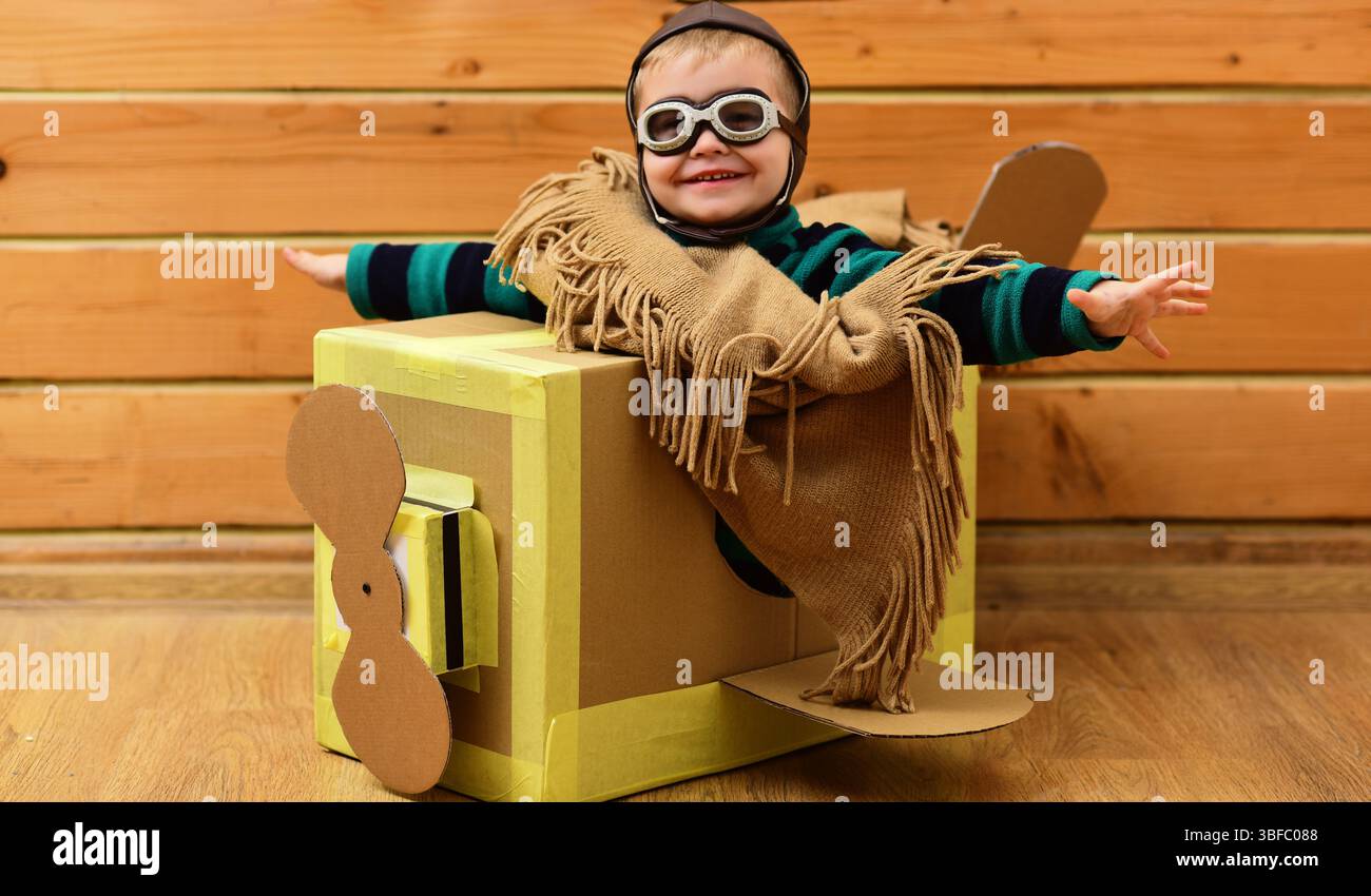 Flying child flying with cardboard wings. Kid dreams of pilot. Baby fly ...