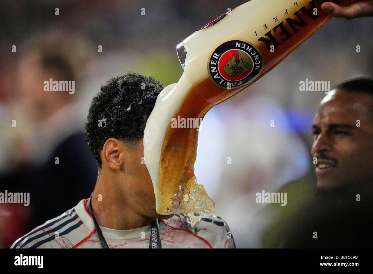 Bayern's Jamal Musiala is doused with beer after the German Bundesliga ...