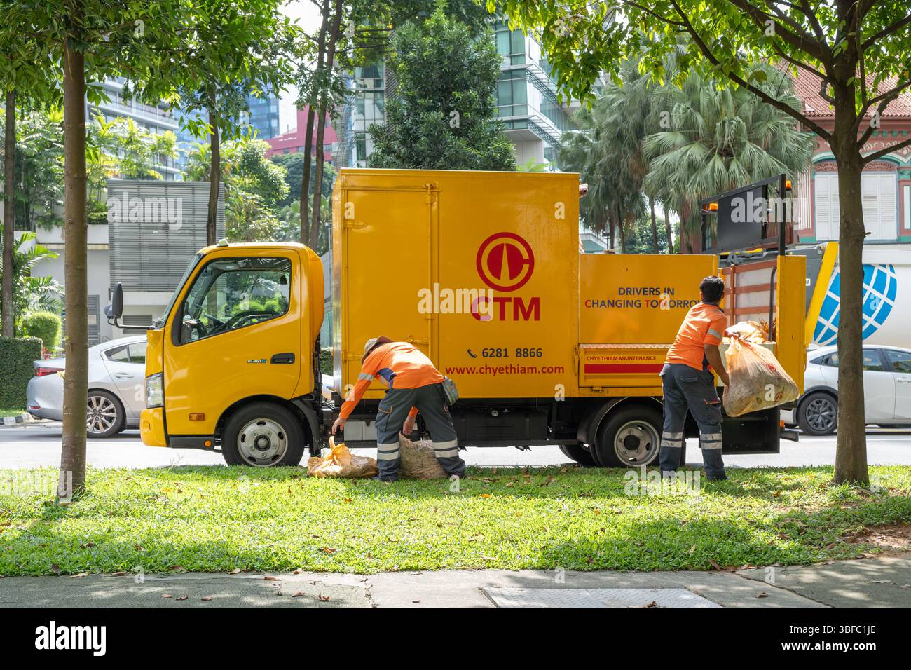 Singapore, Singapore - May 01, 2025: A yellow CTM truck is parked on ...