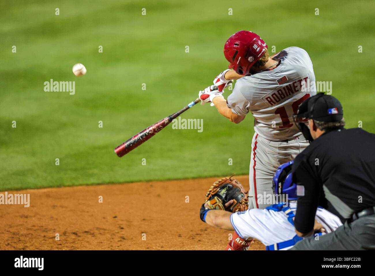 May 31, 2025: Reese Robinett (18) of Arkansas looks to put a ball in ...