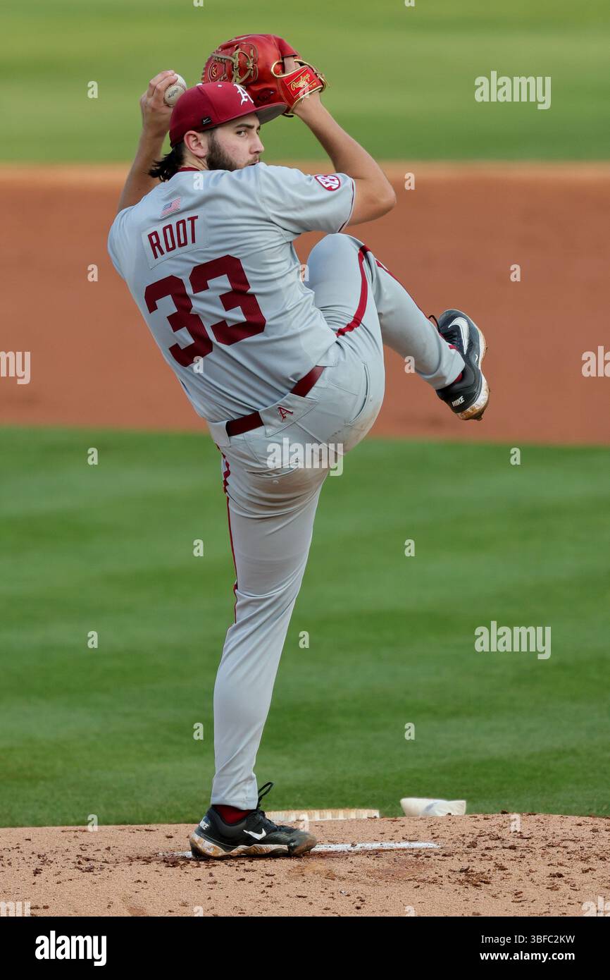 May 31, 2025: Arkansas pitcher Zach Root (33) lifts his leg to begin ...