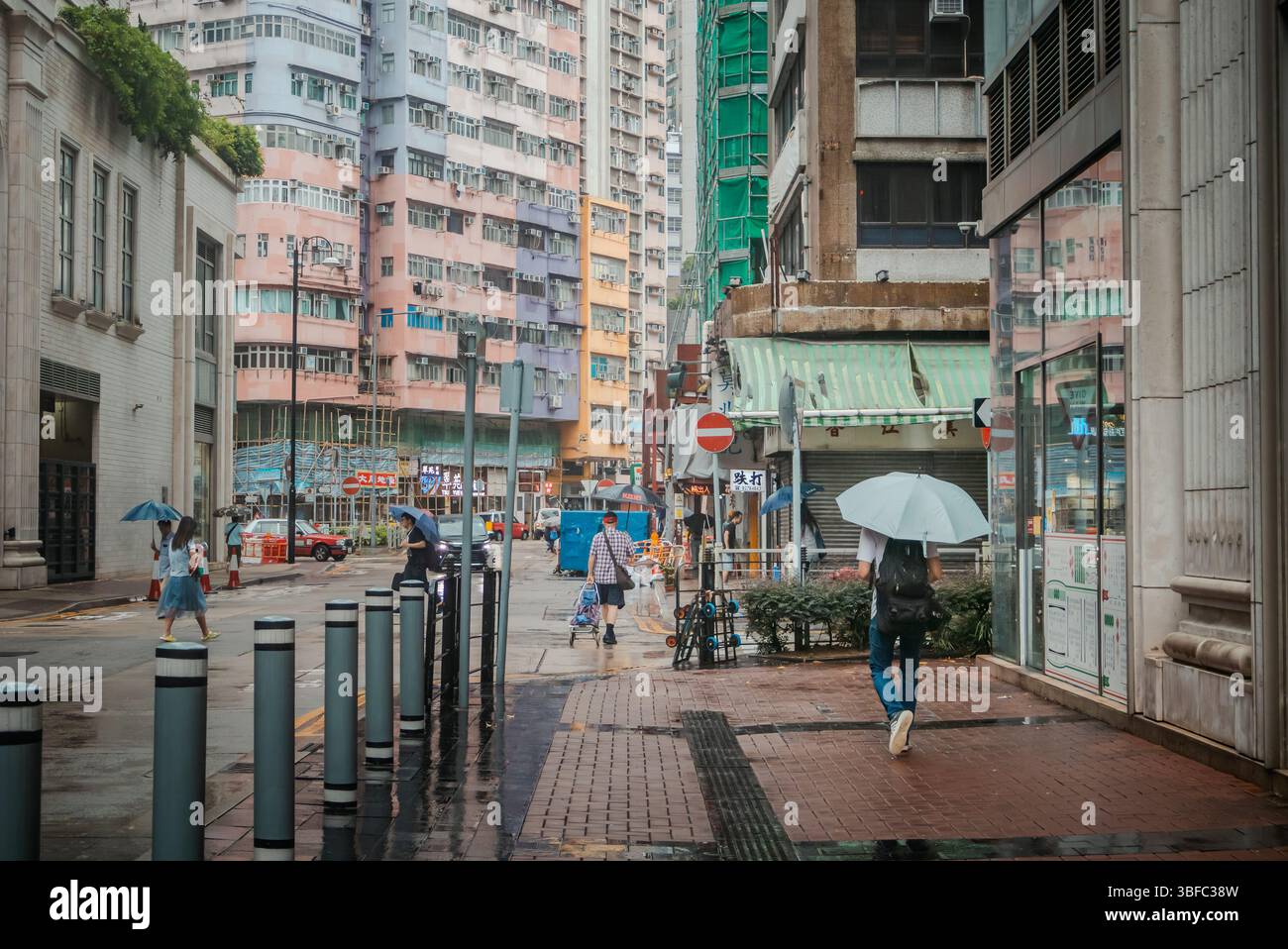 City streets of Hong Kong during a cloudy, rainy day Stock Photo - Alamy