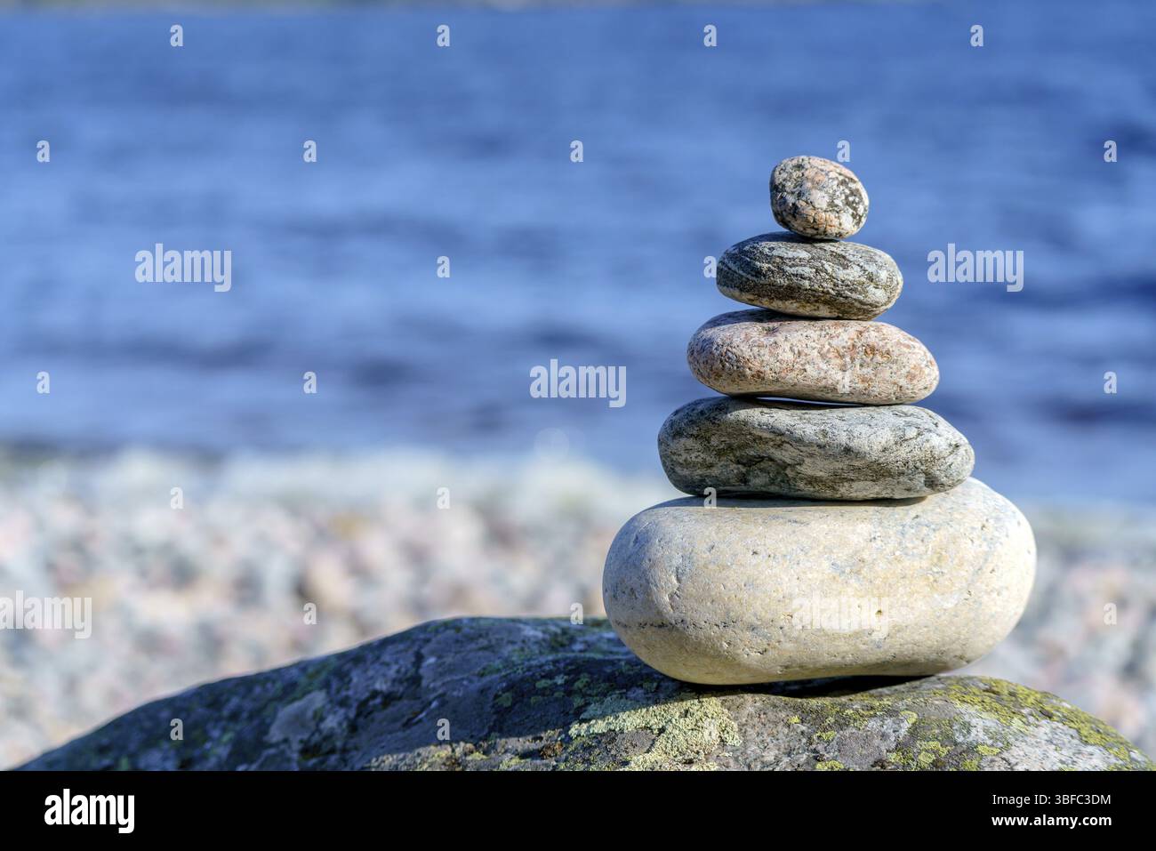 Pyramid of stones. Unstable balance of stone objects. Idyllic state of ...