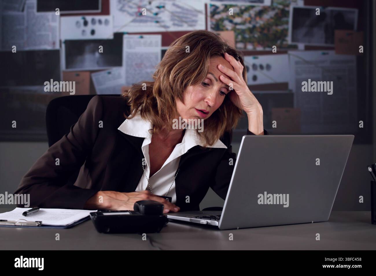 Stressed Detective Talks On Phone At Police Station, Evidence Search ...