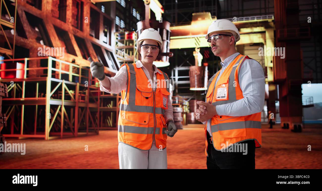 Quality Control Team At Steel Manufacturing Plant Discussing Ironwork ...