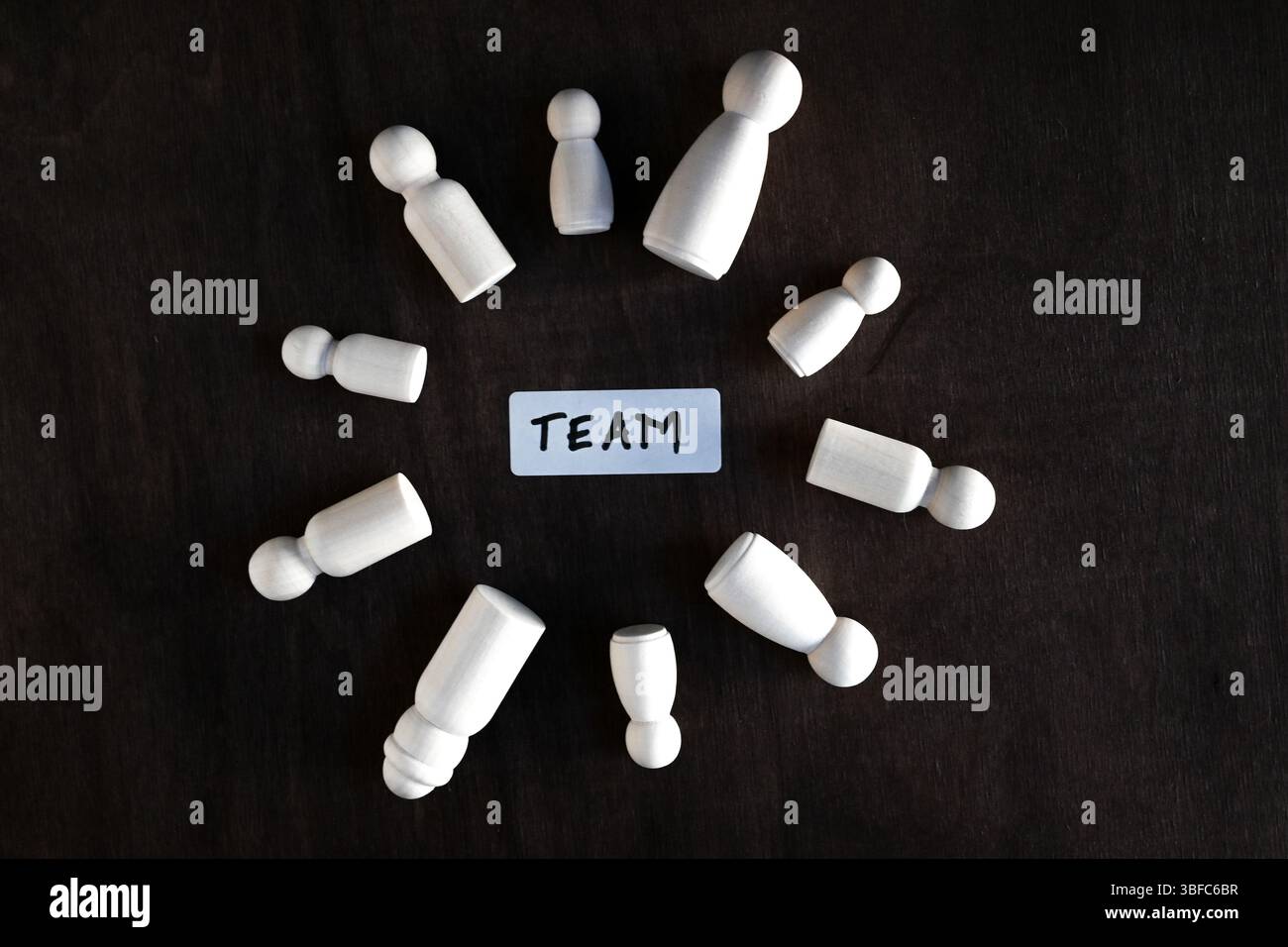 wooden peg dolls in a team - concept photo representing teamwork and ...