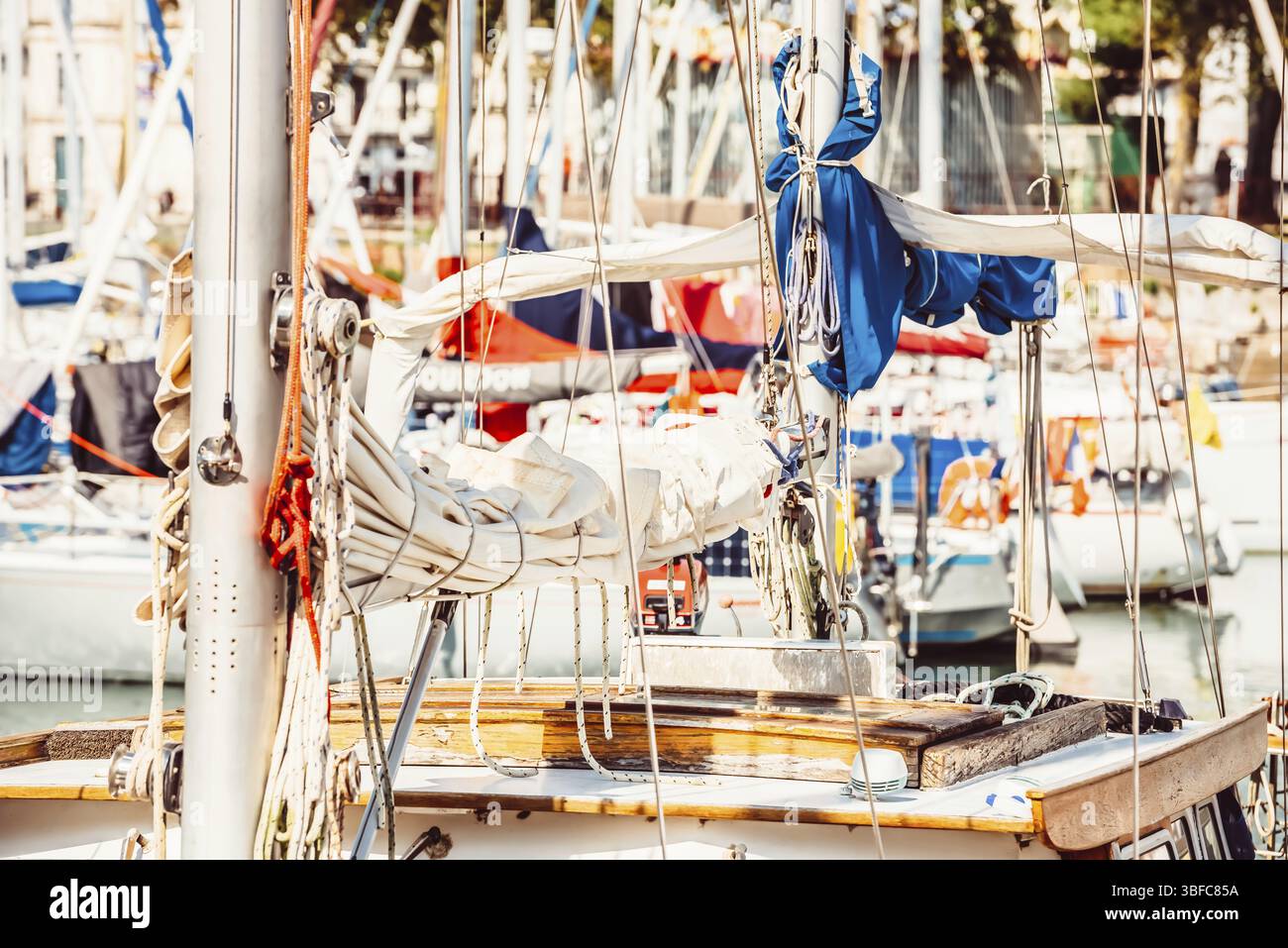 Sailboats in marina with rigging details and vibrant colors, background ...