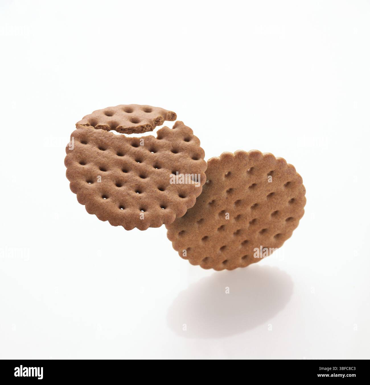 Round ginger biscuits, flying food Stock Photo - Alamy