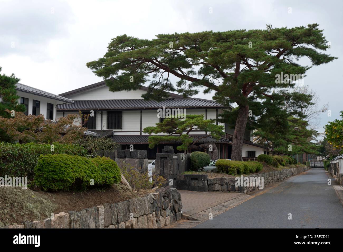 Streets lined with stone and earthen walls of the former samurai area ...