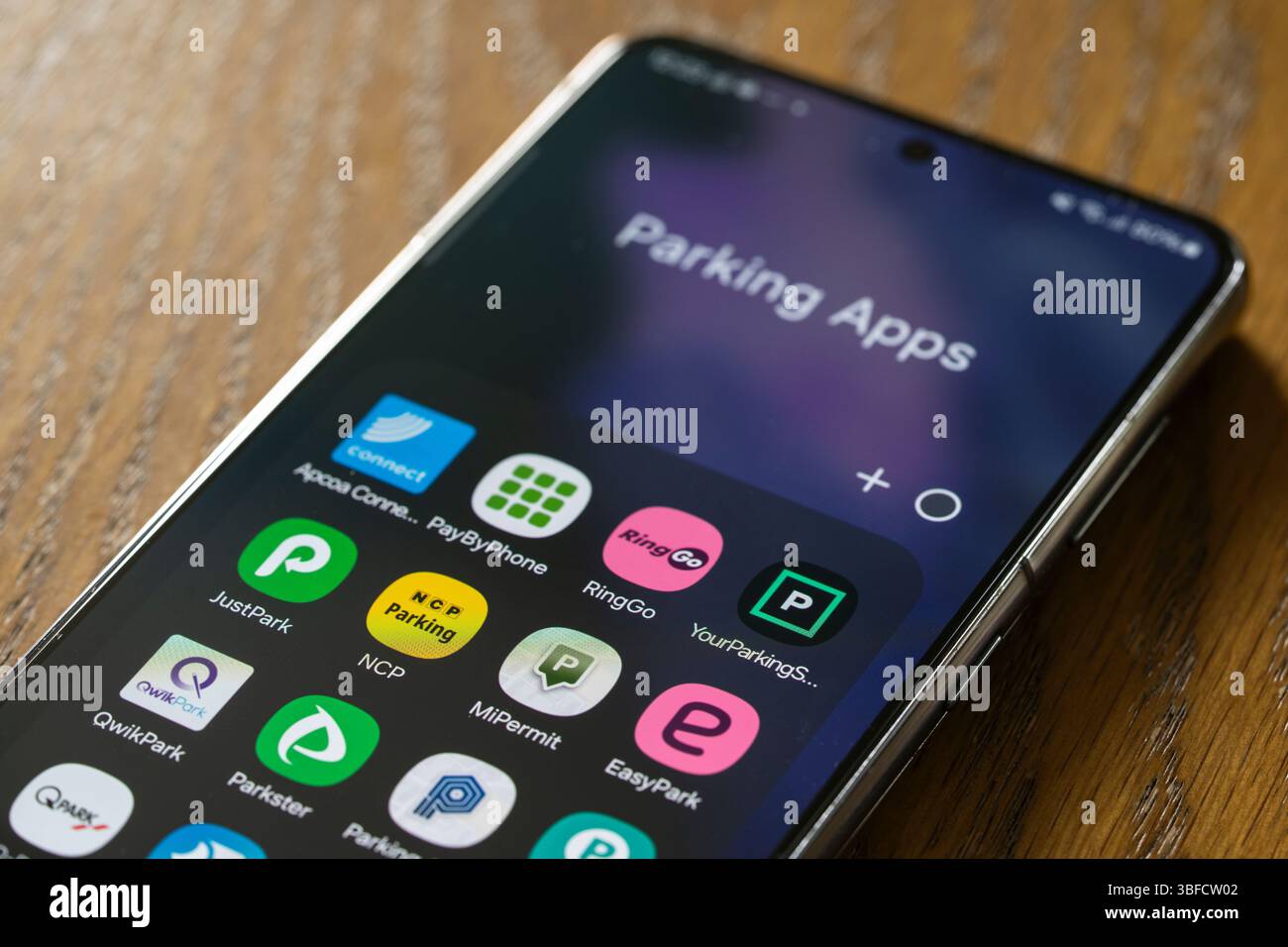 Smartphone showing multiple car parking apps. There is an initiative to replace these with a ...