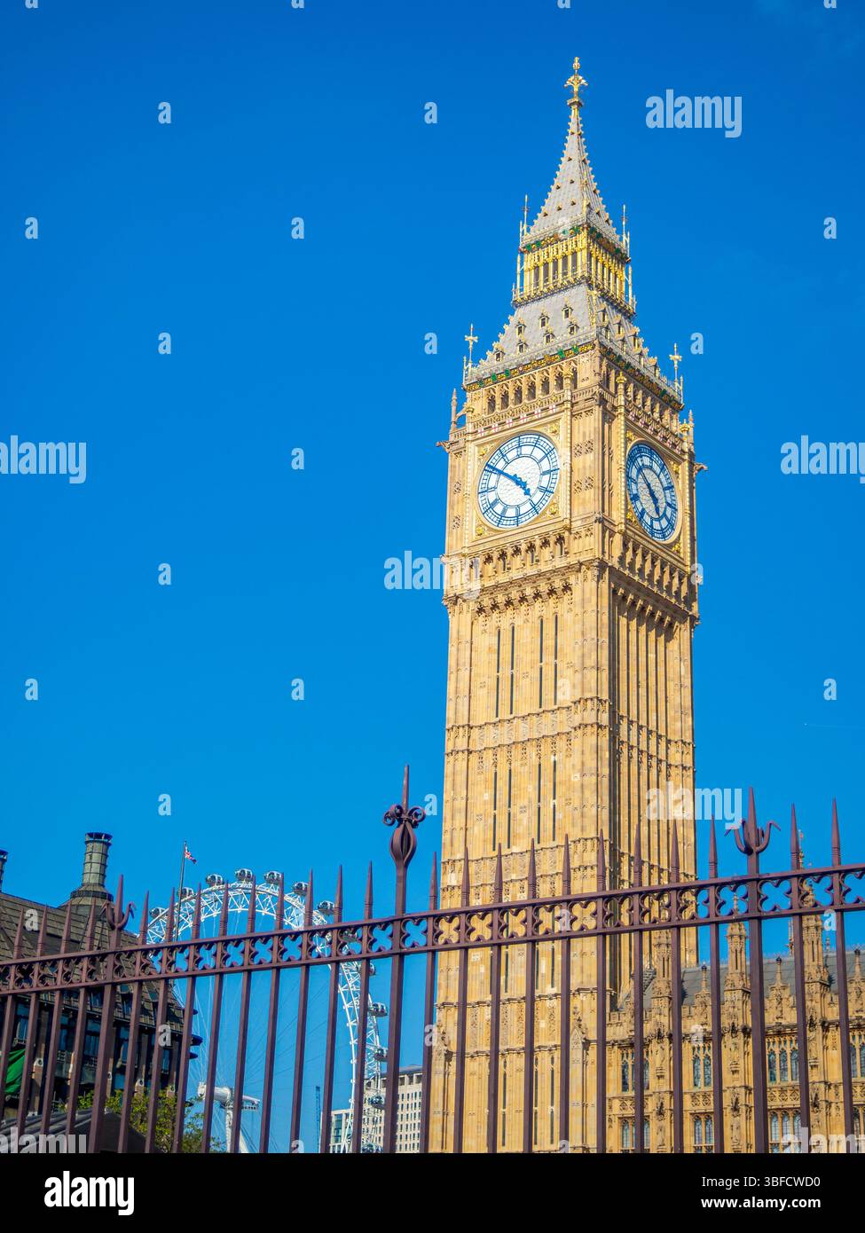View of Big Ben tower from below with clear blue sky background ...
