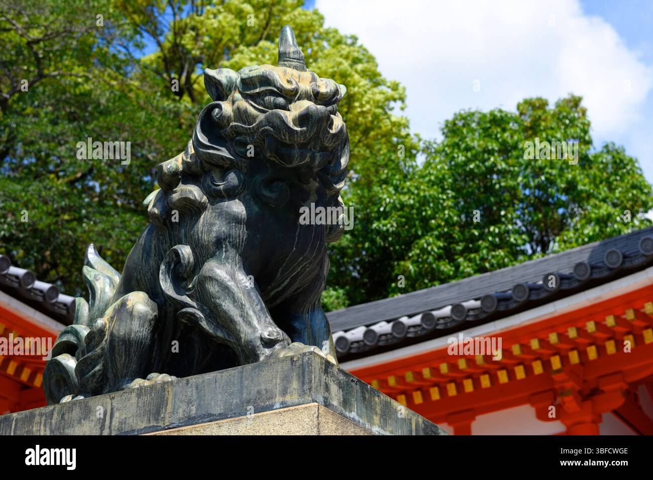 Statue of a guardian figure at the main gate of the Yasaka Shrine, a ...