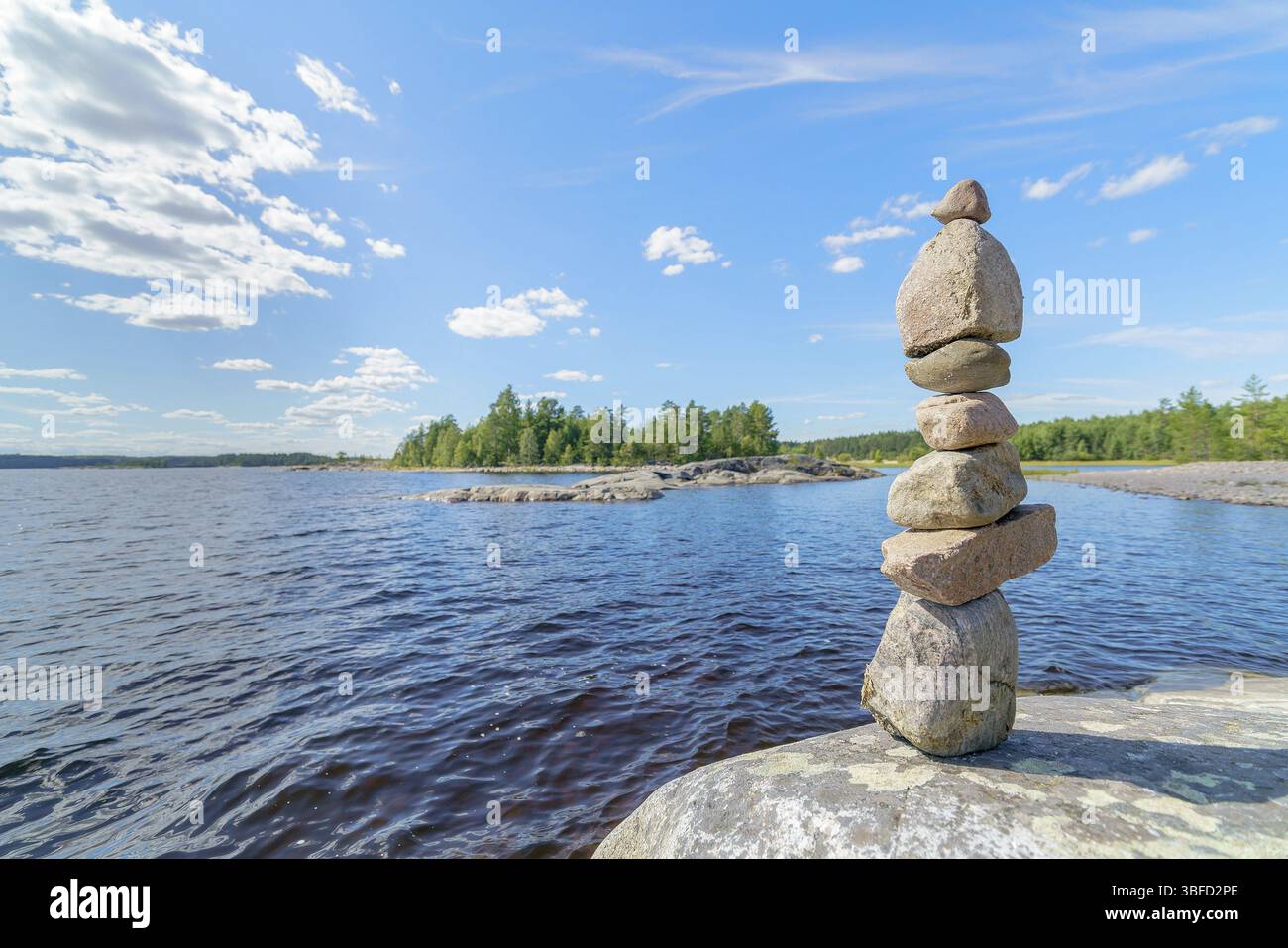 Pyramid of stones. Unstable balance of stone objects. Idyllic state of ...