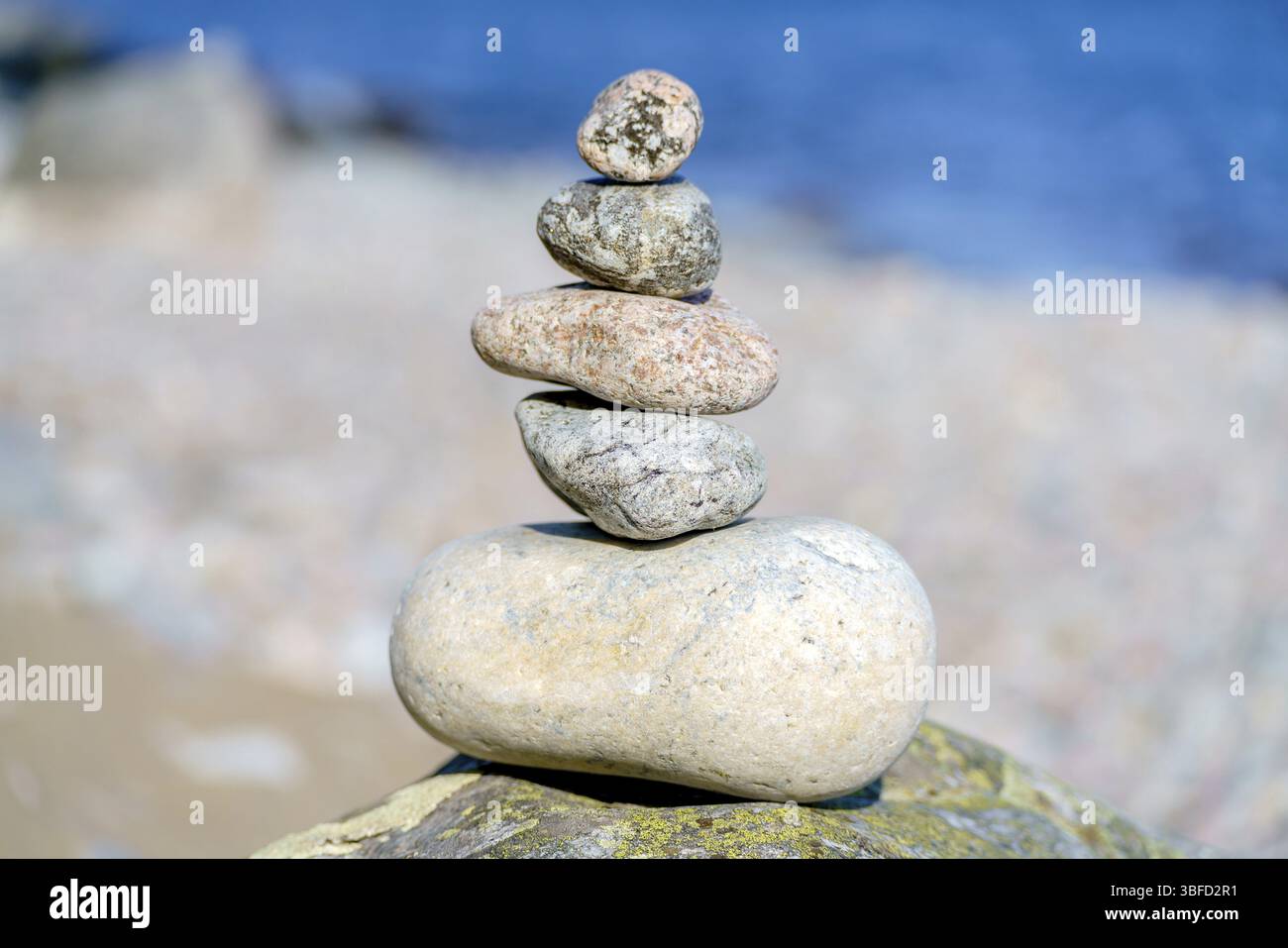Pyramid of stones. Unstable balance of stone objects. Idyllic state of ...