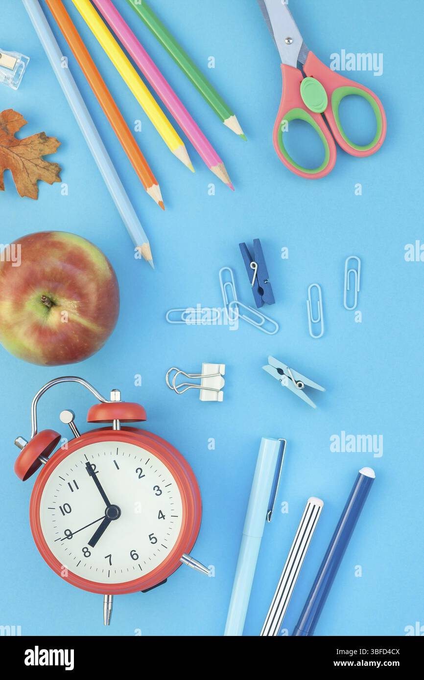 Creative flat lay top view back to school concept with alarm clock ...