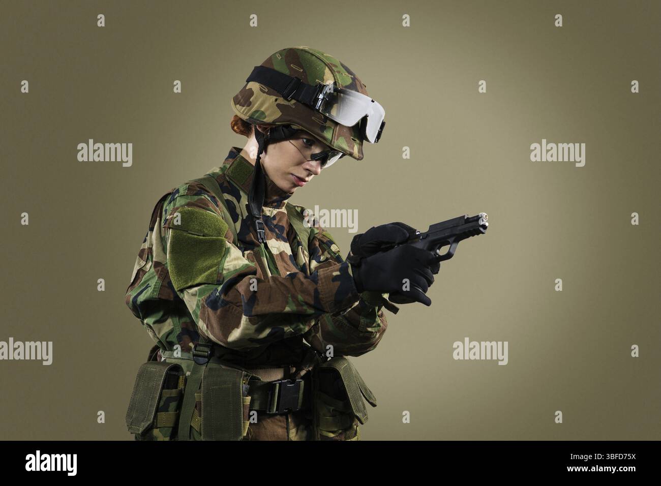 NATO soldier. Military woman over khaki background Stock Photo - Alamy