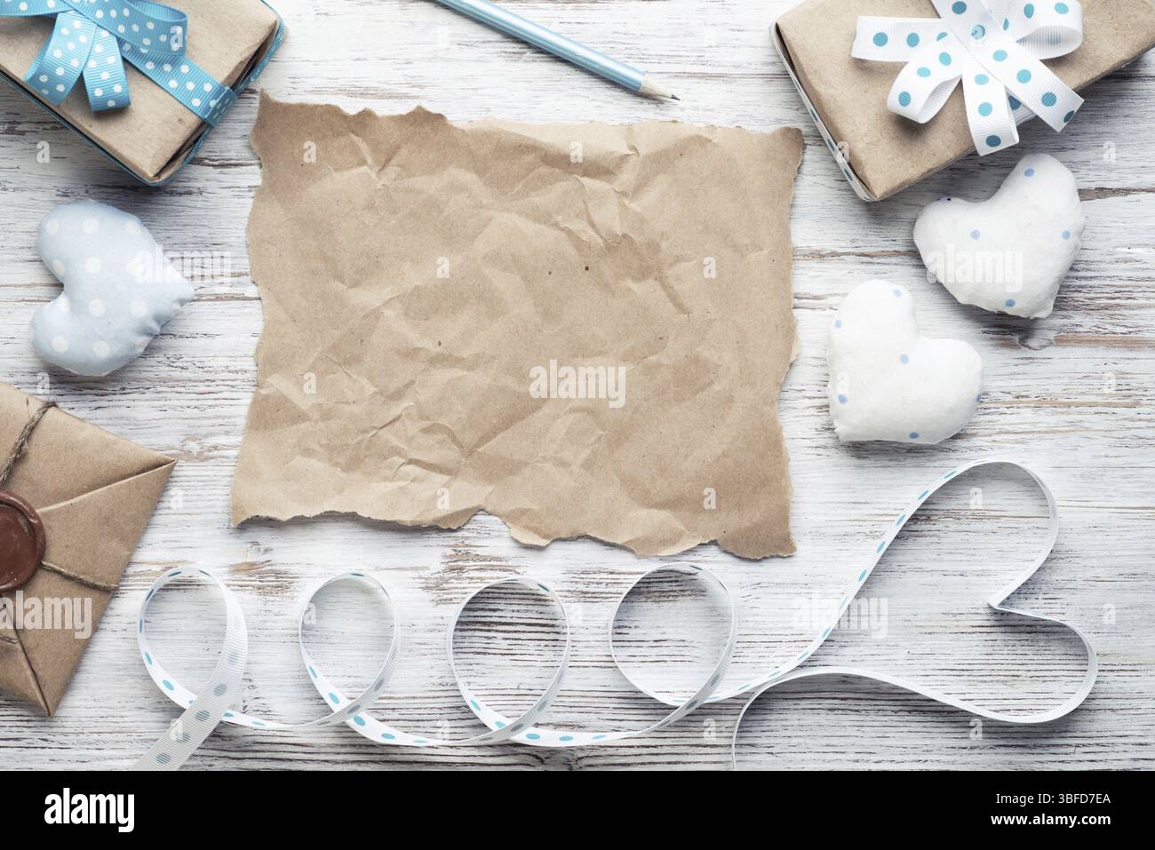 Flat lay vintage composition with fabric hearts. Brown wrapping paper ...