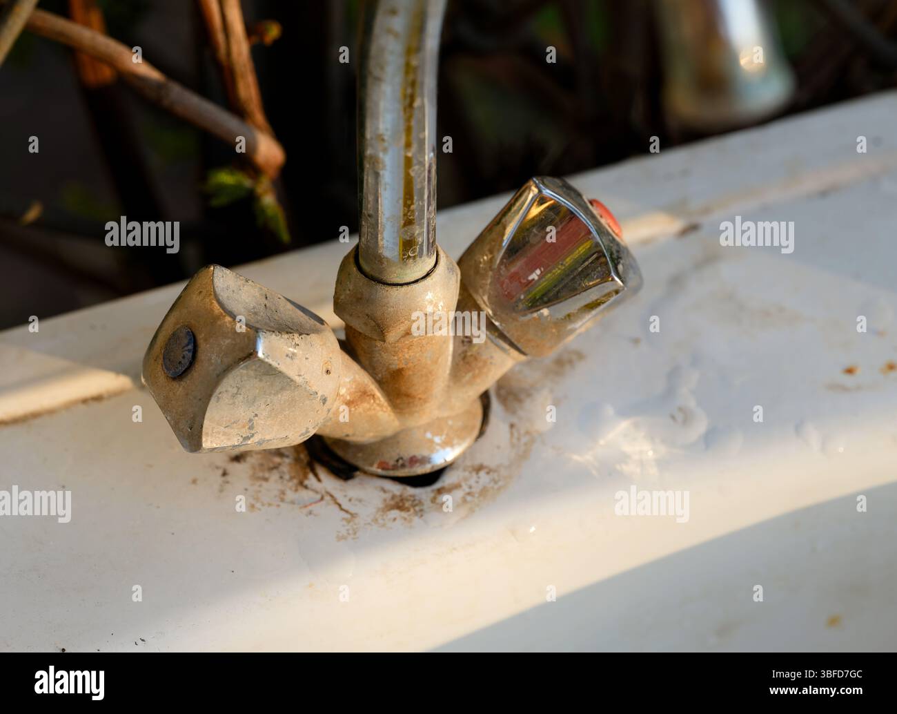 A close-up shot of an old dirty water tap outdoors Stock Photo - Alamy