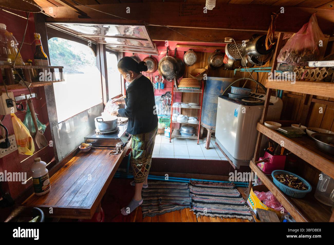A kitchen galley on board the Shampoo cruiser on the Mekong River in northern Laos, Southeast ...