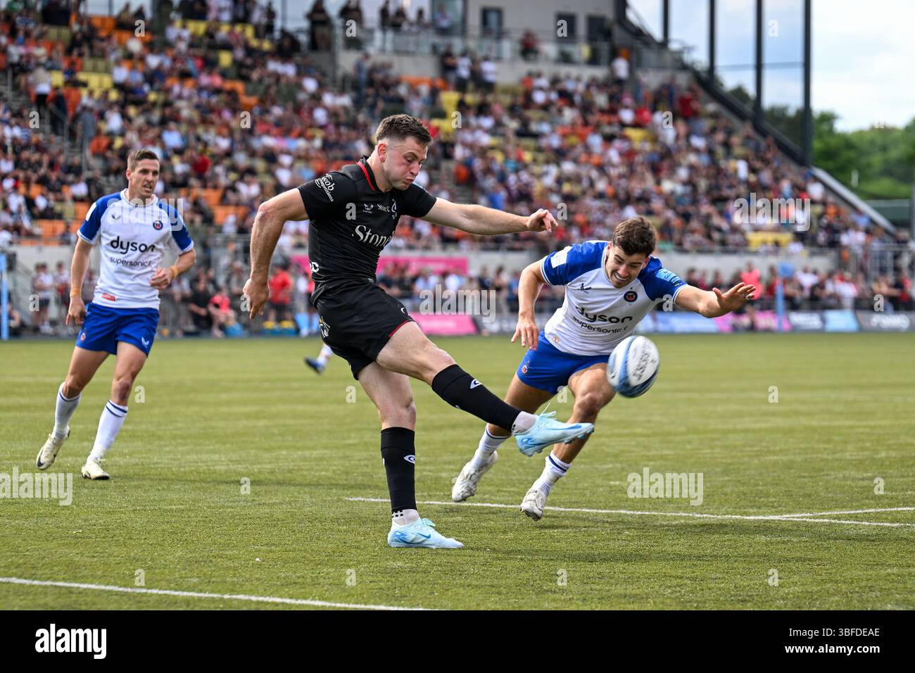 London, UK. 31st May, 2025. Fergus Burke of Saracens kicks to clear the ...