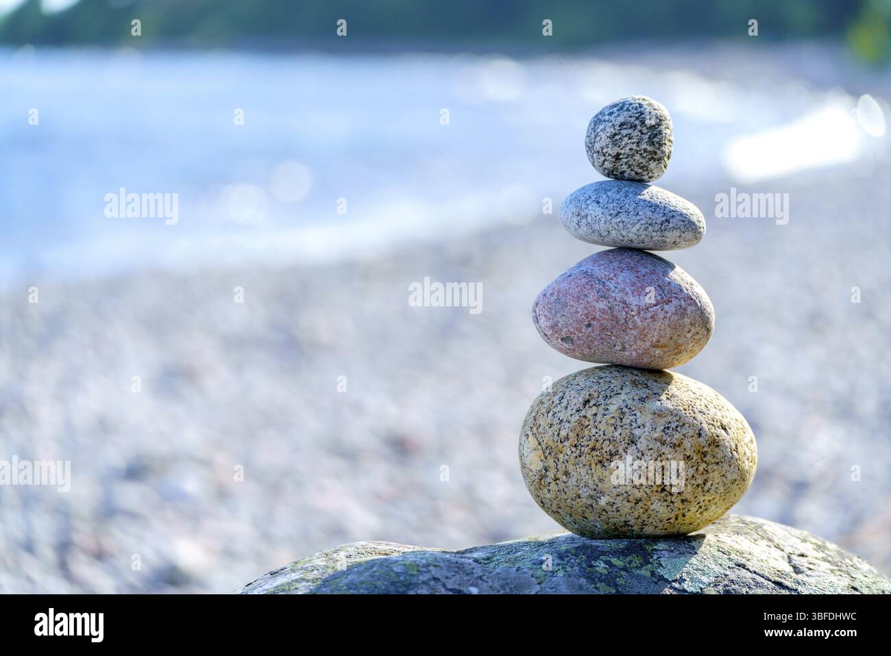 Pyramid of stones. Unstable balance of stone objects. Idyllic state of ...
