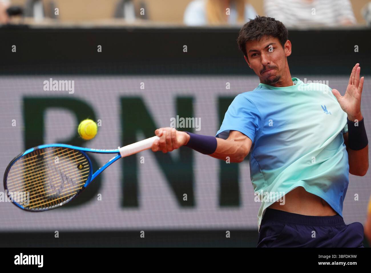 Australia's Alexei Popyrin returns the ball to Tommy Paul of the U.S ...