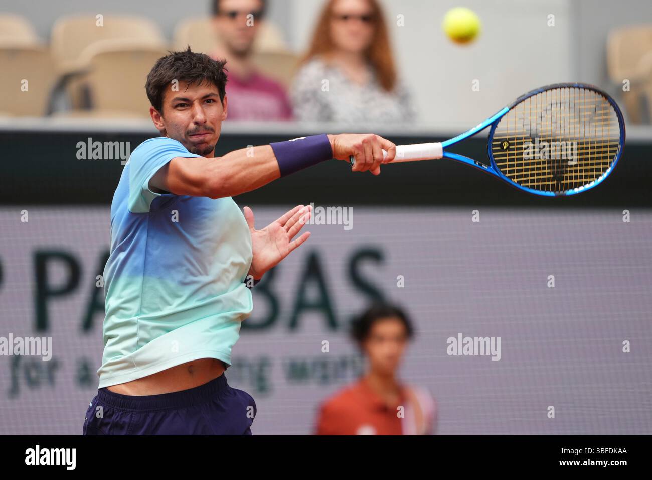 Australia's Alexei Popyrin returns the ball to Tommy Paul of the U.S ...