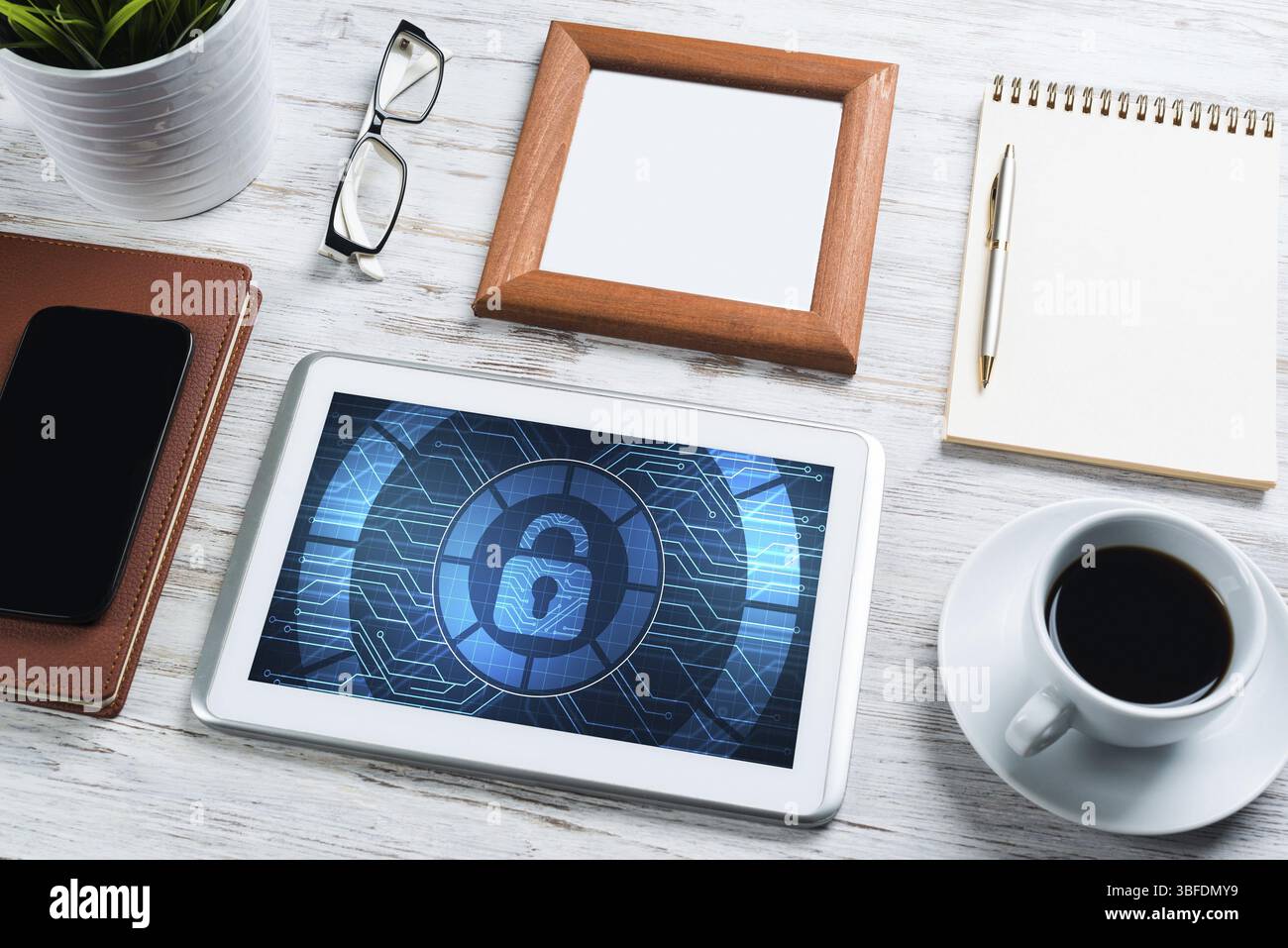 Business workplace with office stuff and tablet with padlock icons on ...