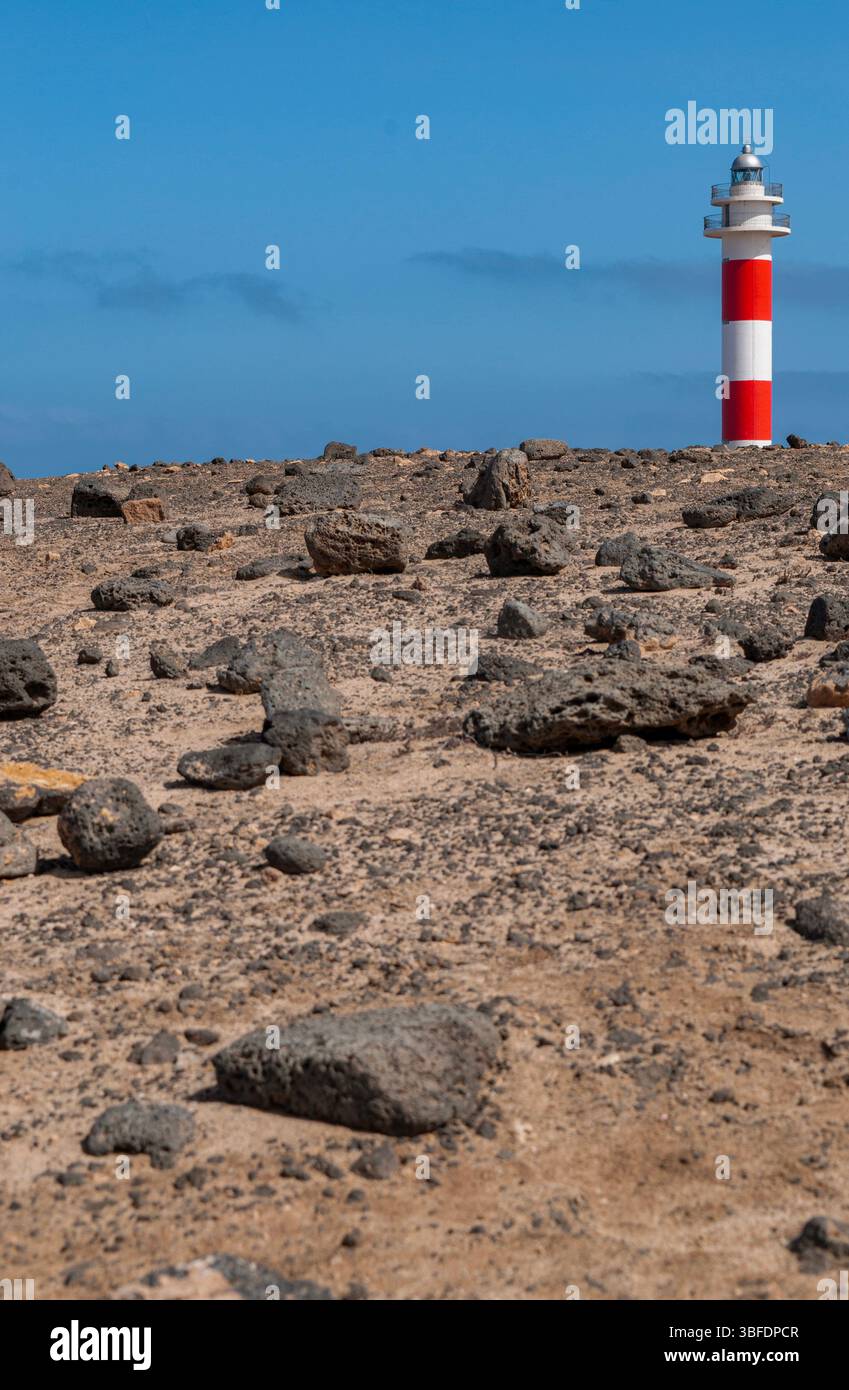 Fuerteventura: black rocks and view of Faro de Toston (Toston or El ...