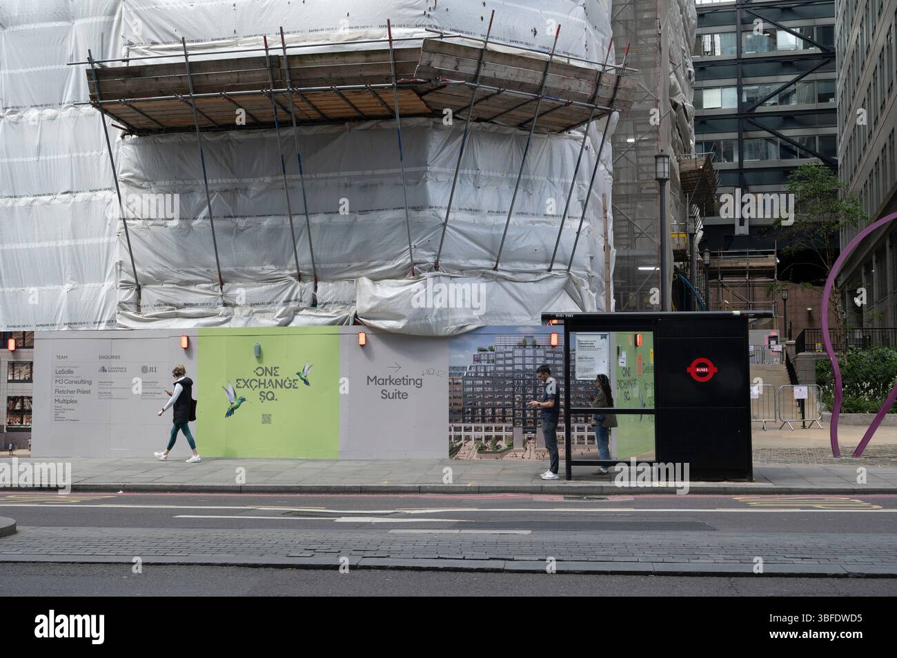 East London . Liverpool Street. Bus stop and new building covered in ...