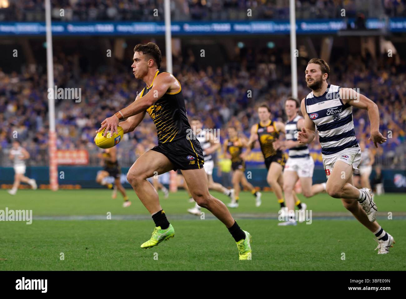Elijah Hewett of the Eagles runs the ball during the AFL Round 12 match ...