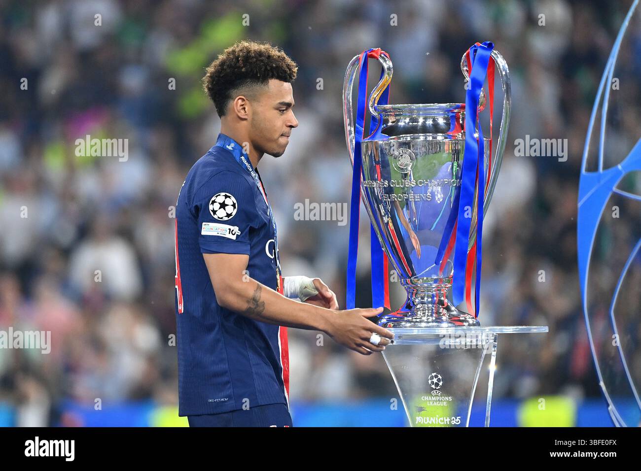 Desire Doue (PSG) with the cup, trophy, award ceremony, football UEFA ...
