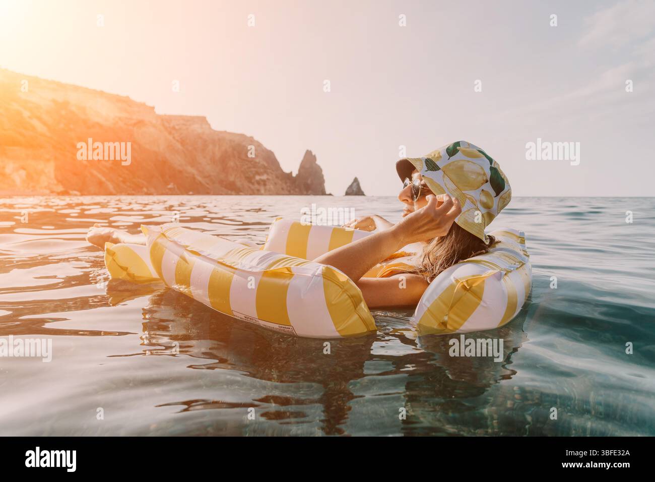 Woman Inflatable Float Sea Relaxing on a Striped Inflatable Float in ...
