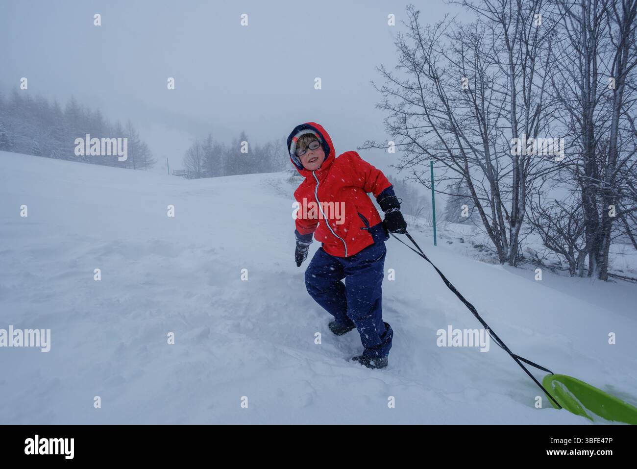 Boy snowsuit red snowsuit hi-res stock photography and images - Alamy