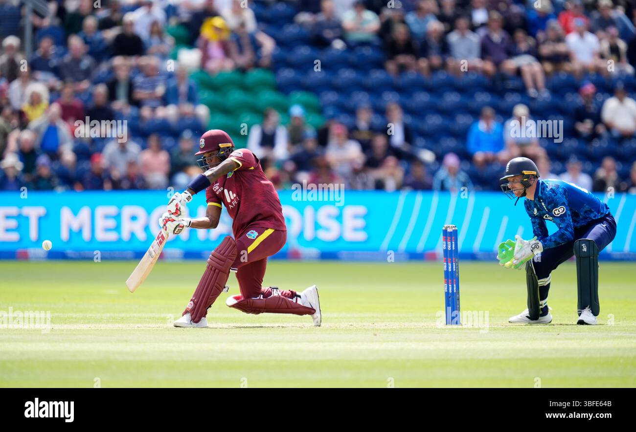 West Indies' Brandon King (left) batting as England's wicket keeper Jos ...