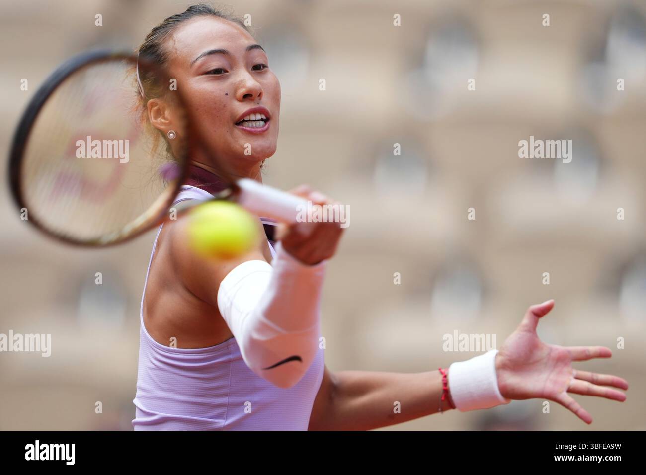 China's Zheng Qinwen returns the ball to Russia's Liudmila Samsonova during their fourth round ...